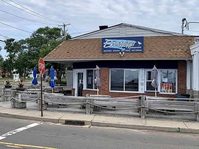 Sandpiper Restaurant's boat-shaped picnic tables are pure coastal Connecticut charm near East Haven's sandy beaches.