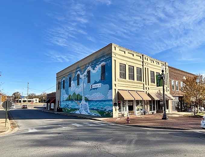 A stunning mural splashes color across brick walls, bringing artistic flair to this quiet downtown intersection and corner.