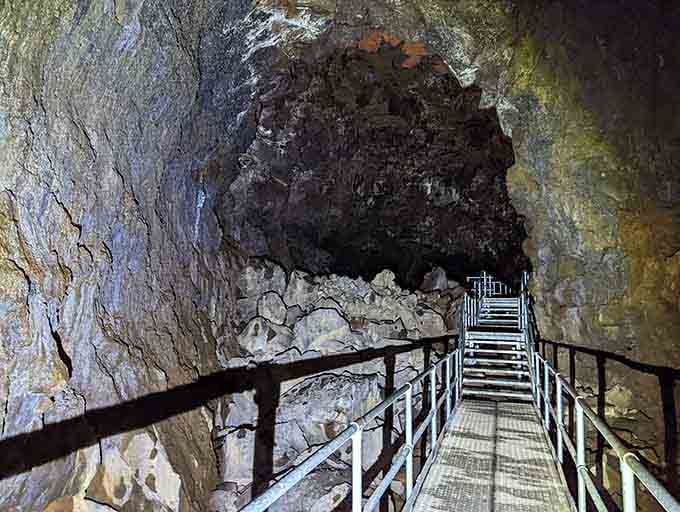 Deep inside the lava tube, stairs lead you further into Earth's belly, where temperatures stay cool year-round.