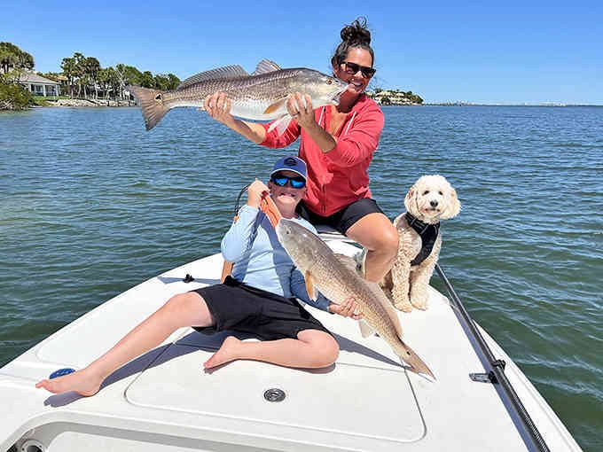Success on the water means happy anglers, proud catches, and one very patient pup enjoying the whole fishing expedition.