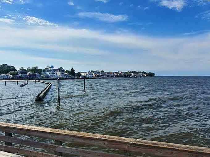 Wooden docks reach across sparkling water toward a distant shoreline that beckons like an old friend waving hello.