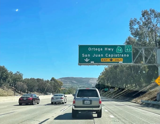 The Ortega Highway sign points toward mountain adventures that feel worlds away from the freeway you just left.