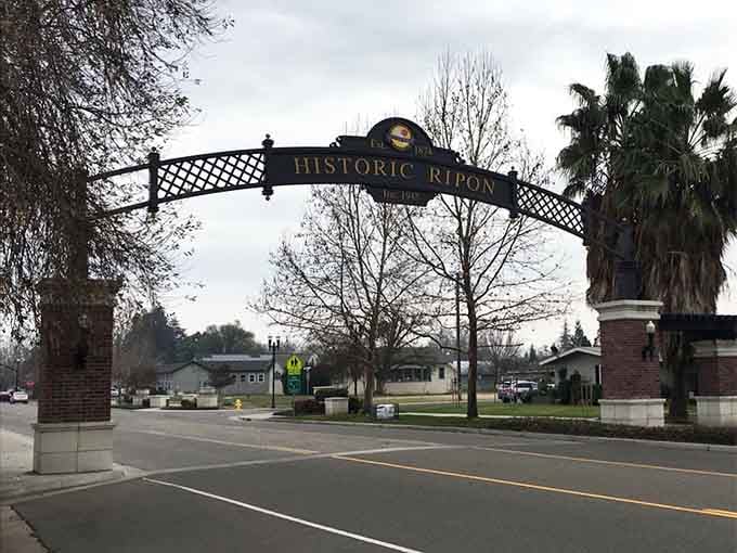 The Historic Ripon arch welcomes visitors to a town where community pride runs deeper than the roots of those palm trees.