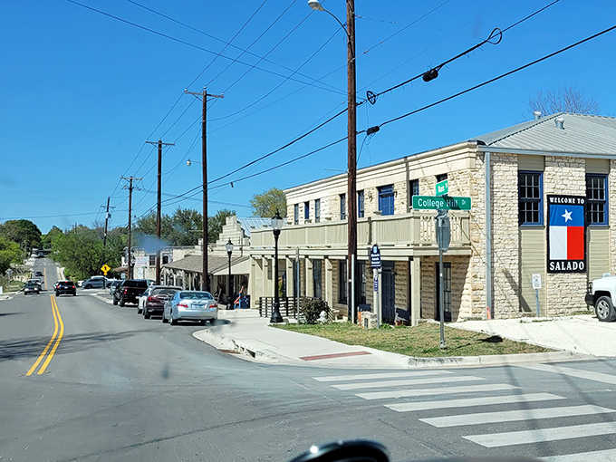 The Texas flag welcomes visitors to limestone buildings that have anchored this crossroads community for generations past.