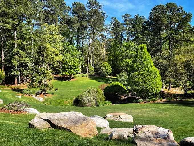 Sculptured evergreens and ancient boulders create a living landscape that changes with every season but always feels timeless.