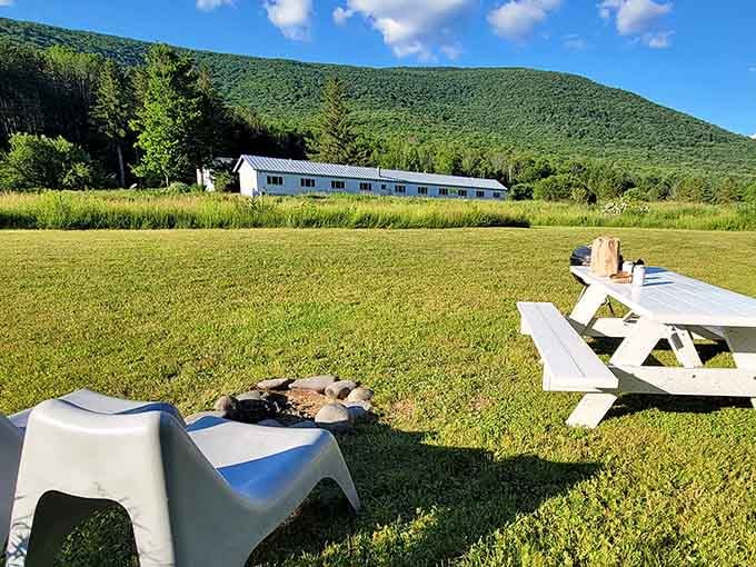 White picnic table, endless green meadow, mountain backdrop&mdash;this is what people mean when they say "room with a view."