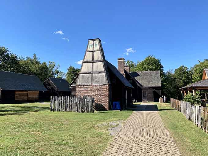 The colonial-era tobacco barn's distinctive pyramid roof stands as a testament to centuries of history still breathing in this place.