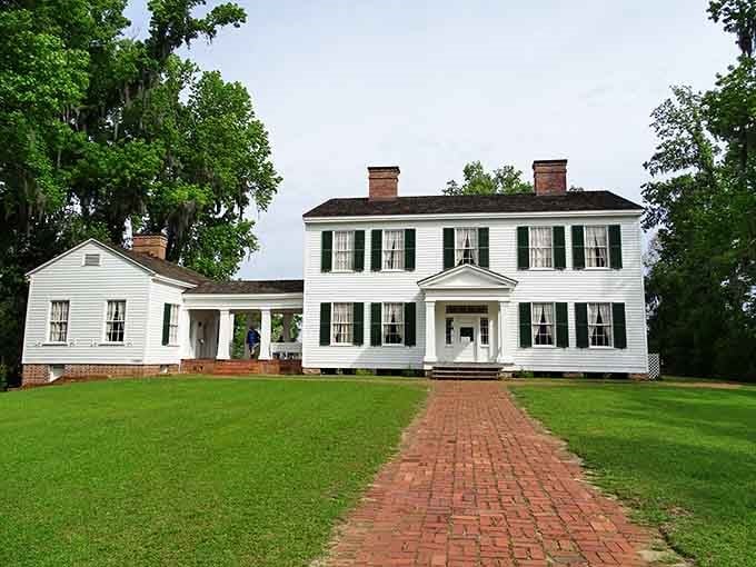 This stately plantation home stands proud, its brick walkway leading visitors back through generations of Southern heritage.
