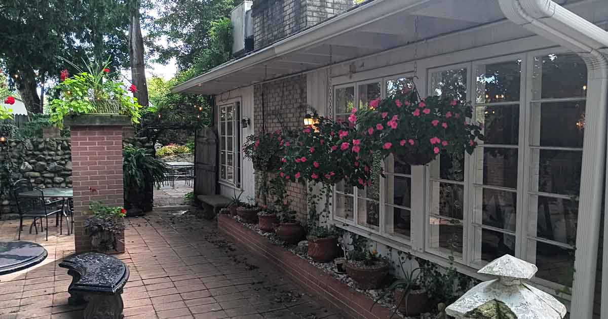 The Whimsical Indiana Restaurant With A Vintage Garden Porch You'll Adore