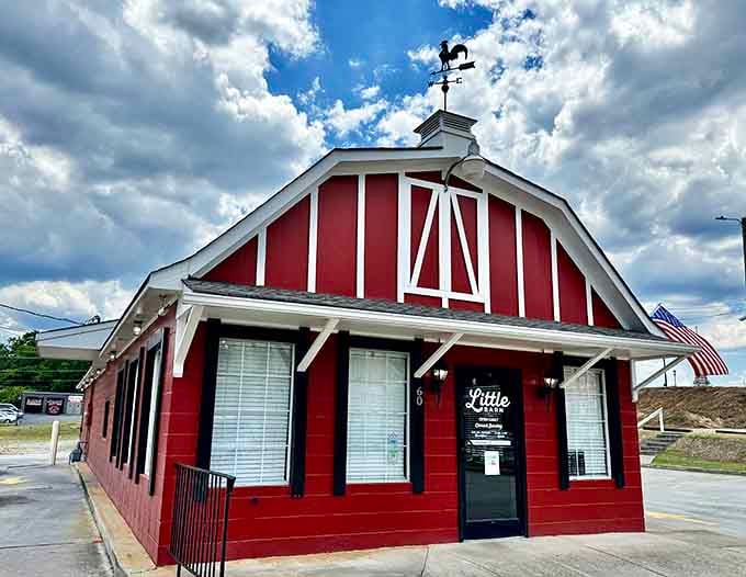 That weathervane rooster perched on top means serious breakfast business happens inside this charming red barn.