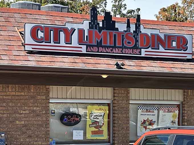 Bold red letters and a miniature cityscape beckon hungry travelers like a lighthouse guiding ships to pancake paradise.