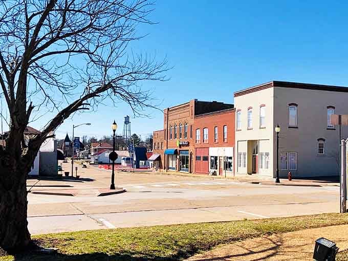 Old brick, bare trees, and a water tower keeping watch. Small-town America doesn't get more honest than this.