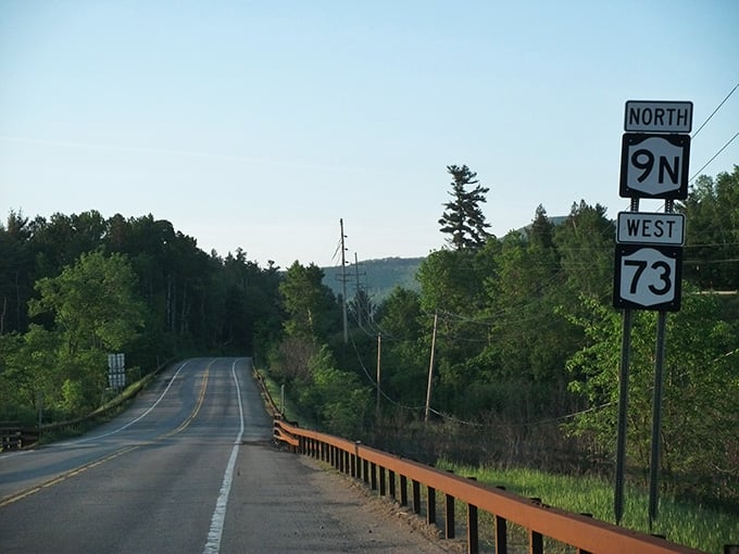 Route 73 cuts through mountain walls like nature forgot to leave a door, and somehow that's perfect.