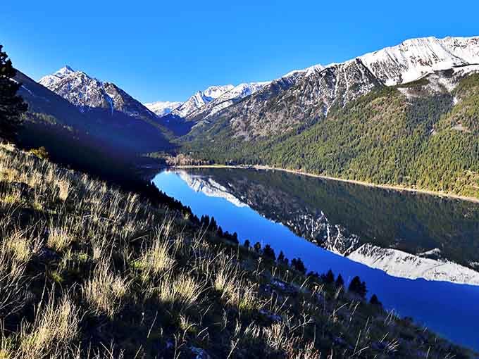 Morning light turns the whole valley into a symphony of blues and golds that no filter could ever improve.
