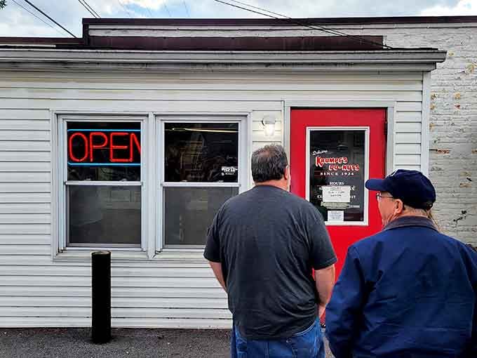 Two gentlemen contemplating life's sweetest decisions at a window that's fed generations of happy customers.