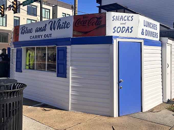That vintage Coca-Cola sign and bold blue trim say everything: this corner has been serving happiness for a long time.