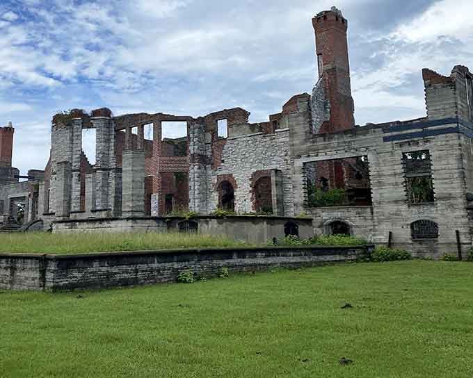 Those brick chimneys still reaching skyward tell you everything about how grand this place once was.