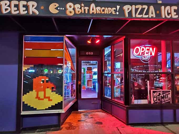 That glowing "Open" sign at 8-Bit Arcade is basically a bat signal for fun-seekers.