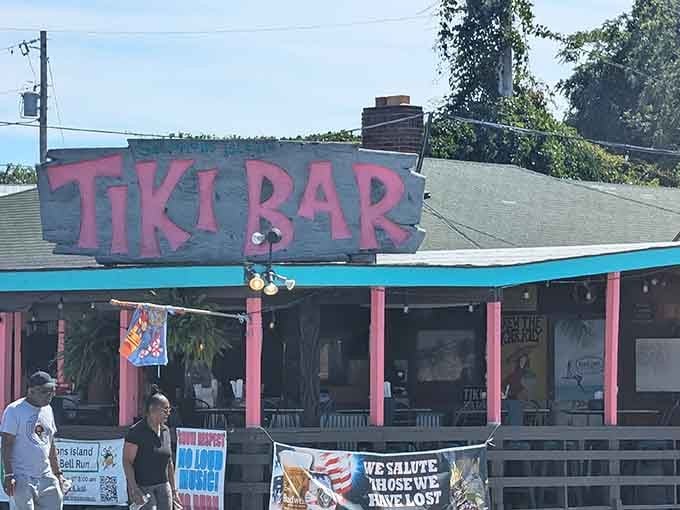 That pink sign isn't just a landmark, it's a full-on invitation to forget your worries completely.