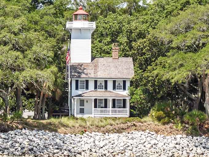 This white lighthouse cottage with its red-roofed tower looks like Nicholas Sparks personally designed it for maximum swooning.