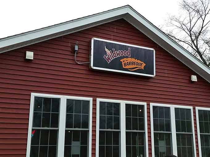 That red barn exterior is hiding some serious smoky secrets inside, and your taste buds are about to find out.