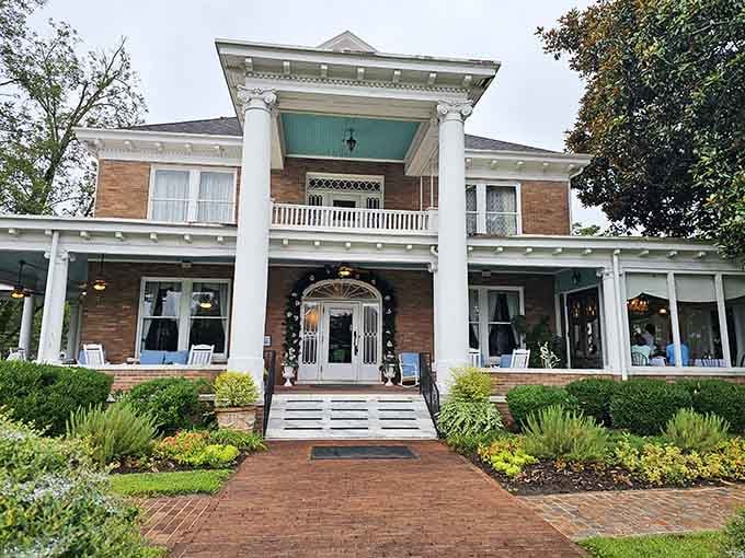 Those white columns and teal porch ceiling aren't just pretty, they're a promise of something genuinely special waiting inside.