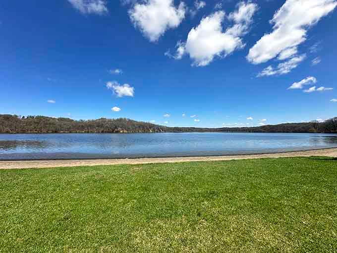 That vivid blue sky and glassy shoreline? Nature just handed you a free therapy session.