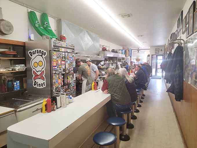 That skull-and-crossbones logo says it all: this counter is where breakfast gets serious, one blue stool at a time.