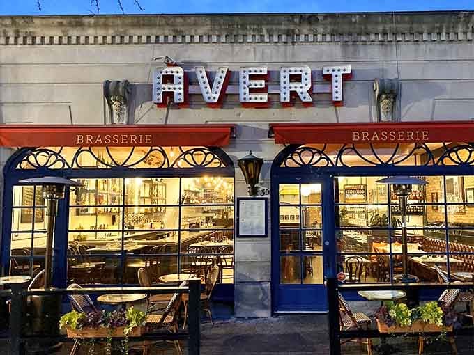 That vintage marquee lighting spells out exactly where your next great meal awaits, glowing like a Broadway show for your taste buds.