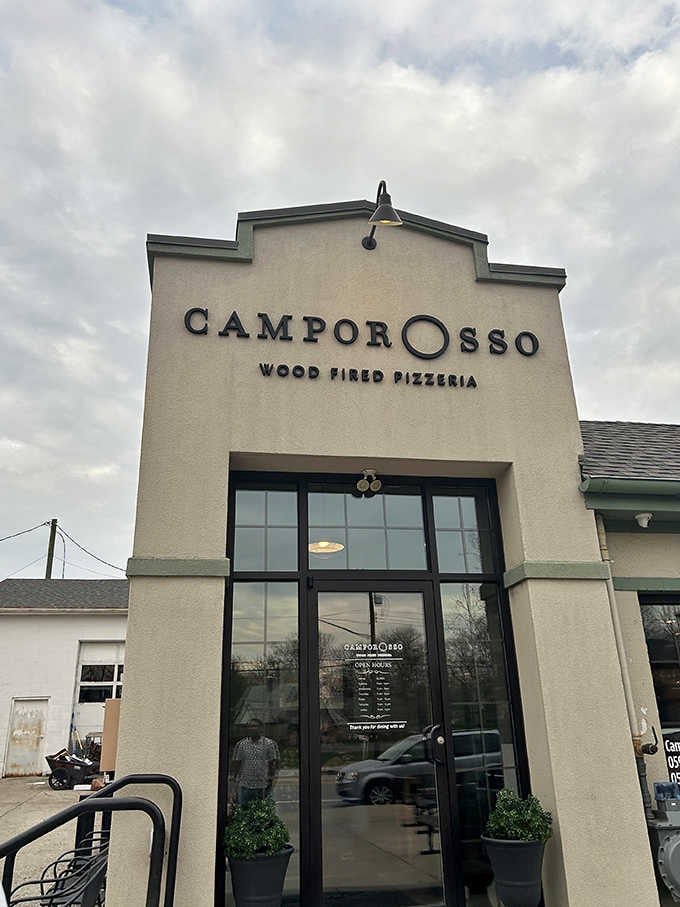 The entrance beckons like a portal to carb heaven, promising wood-fired wonders just beyond those doors.