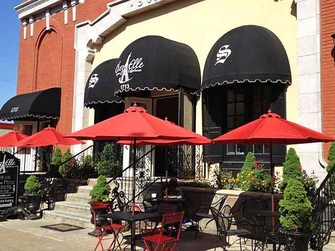 Black awnings, wrought iron railings, and a warm yellow facade &mdash; Paris called, and Kansas City answered beautifully.