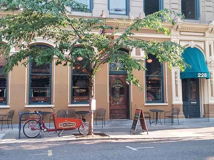 Wrought iron chairs, teal awnings, and a sign that says "come in" without saying a word. Portland charm, delivered.