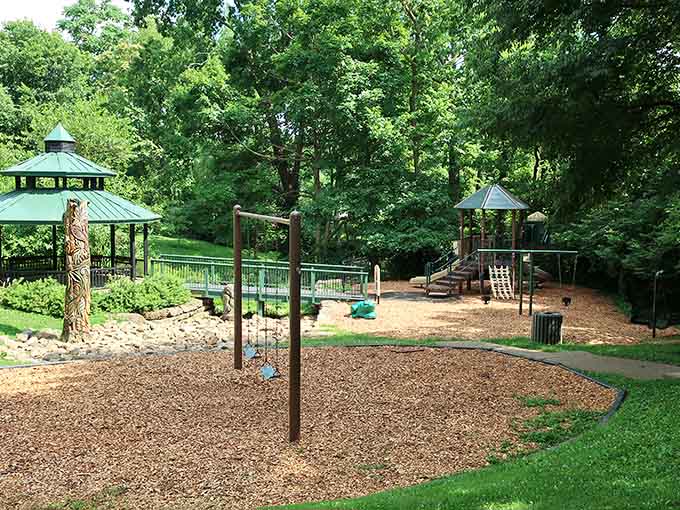 Swings, climbing structures, and a charming gazebo surrounded by lush trees make this park an absolute family favorite!