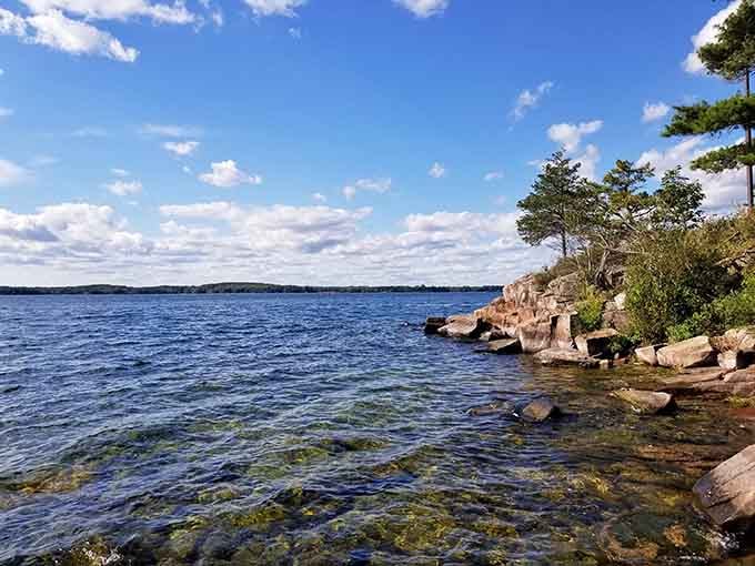 Ancient granite meets the St. Lawrence River here, where the water runs so clear you'd swear it's showing off.