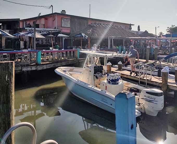 Stan's Idle Hour sits right on the Goodland waterfront, colorful and unapologetic, like Florida forgot to grow up here and decided that was perfectly fine.