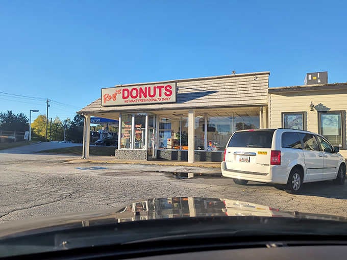 That unassuming storefront under the morning sky holds more sweetness than a Hallmark movie marathon on a Sunday afternoon.