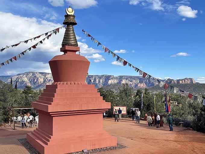 The stupa rises against Sedona's dramatic cliffs like a postcard from the Himalayas that somehow ended up in Arizona.