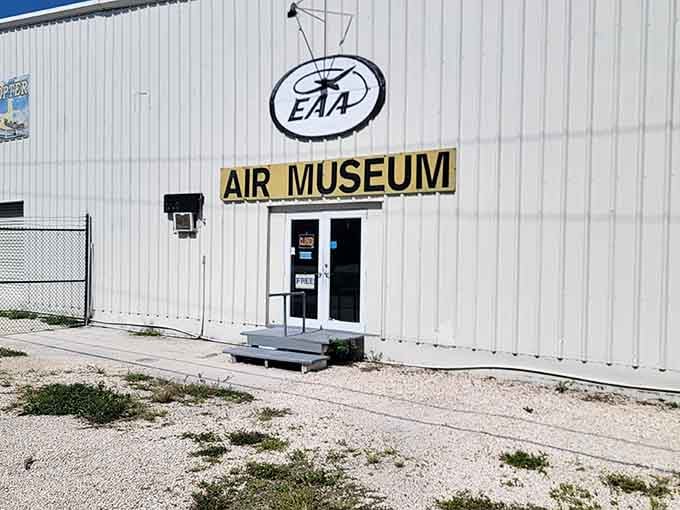 That unassuming hangar holds more history than most museums twice its size, and you can actually touch it all.