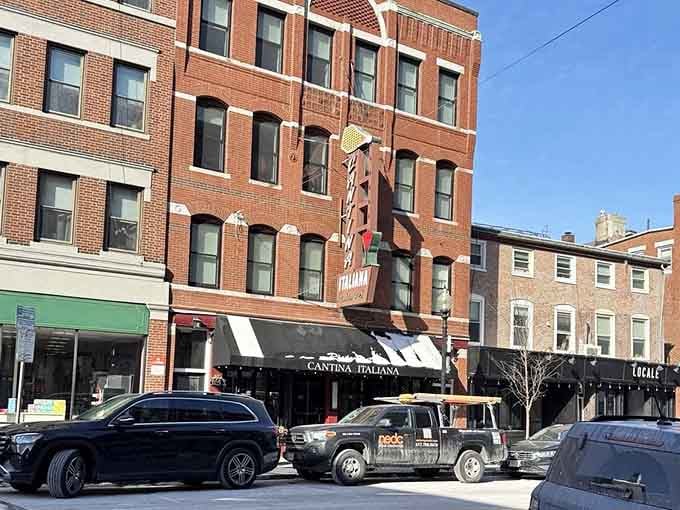 That bold sign rising up the brick facade on Hanover Street isn't asking for your attention, it's demanding it.