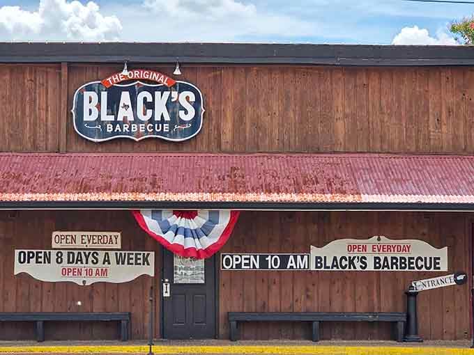 That weathered red roof and wood siding say one thing clearly: serious barbecue lives here, no fuss required.