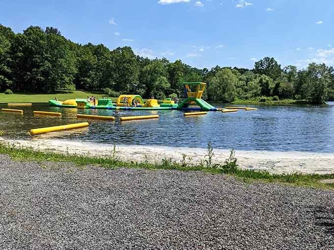 Those bright inflatable obstacles floating on the lake turn adults into kids faster than you can say "cannonball."