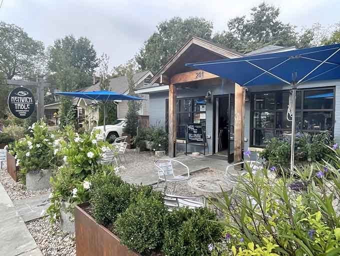 Blue umbrellas and planters create an urban oasis that beats your backyard setup by a mile.