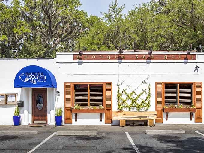 Don't let the modest white exterior fool you, Georgia Sea Grill is hiding serious culinary magic behind that blue awning.