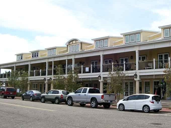 Wraparound balconies and warm Gulf breezes make this downtown block look like a postcard that actually delivered.