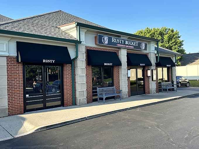 Black awnings, brick walls, and wooden benches out front. This place means business, delicious business.