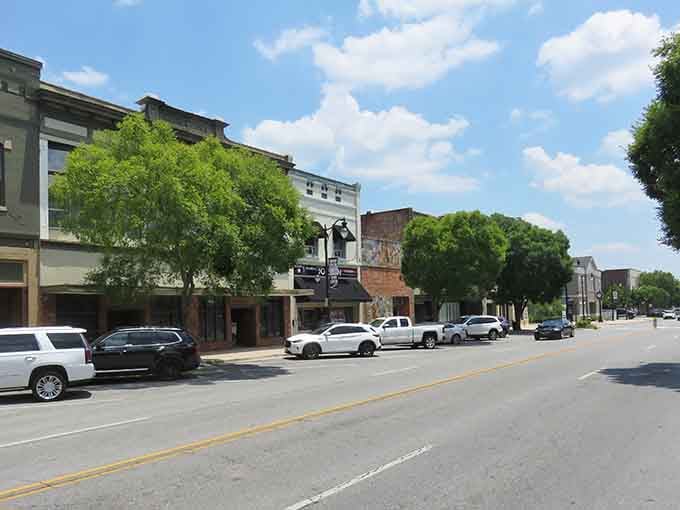 Broad Street's historic storefronts bask under Alabama's summer sky, quietly proving that good bones never go out of style.