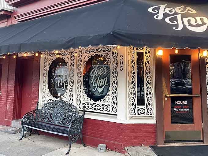 That bold black awning on a red brick corner says it all: something wonderful happens inside Joe's Inn.