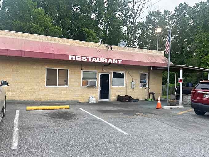 No velvet rope, no valet parking, just honest food waiting behind that red awning.