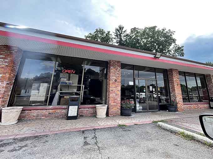 That glowing red "OPEN" sign at Dom Bakeries isn't just a light, it's a personal invitation.