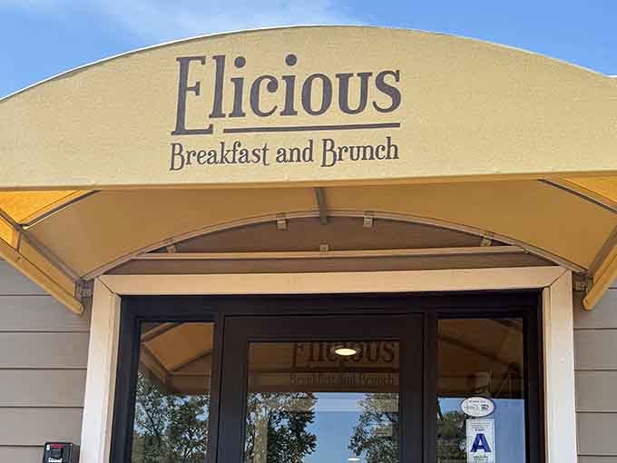 That golden awning isn't just decoration, it's a promise of Southern comfort waiting inside Elicious.